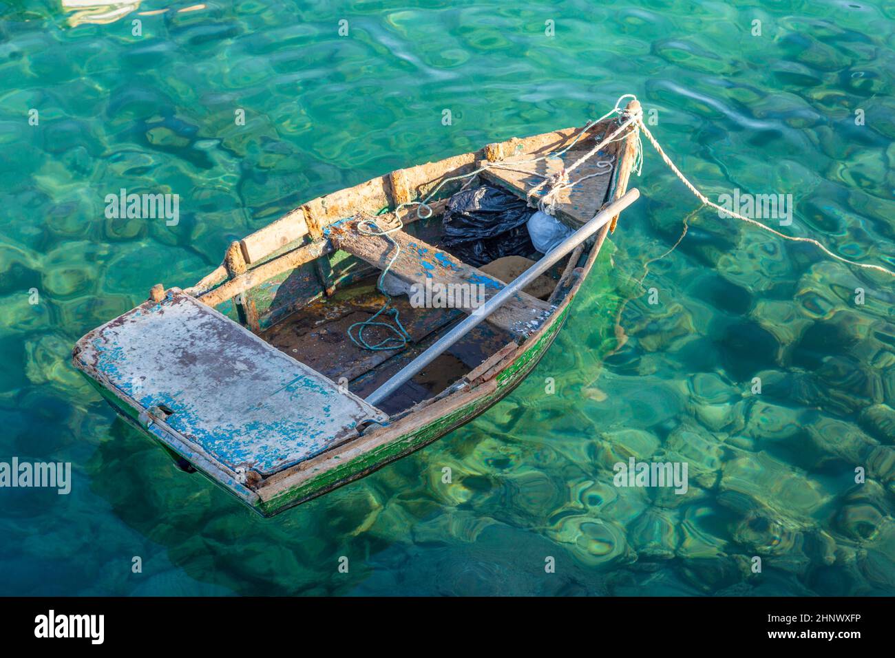old rotten fisher boat swims at the ocean Stock Photo - Alamy