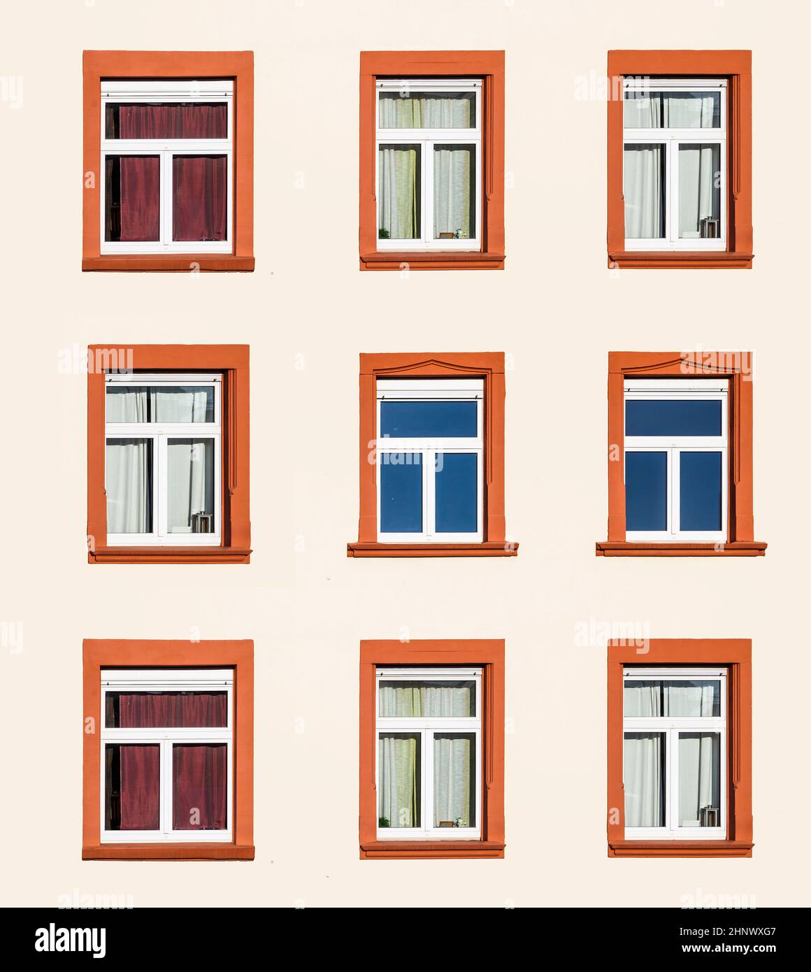 facade of house with four windows in detail Stock Photo - Alamy