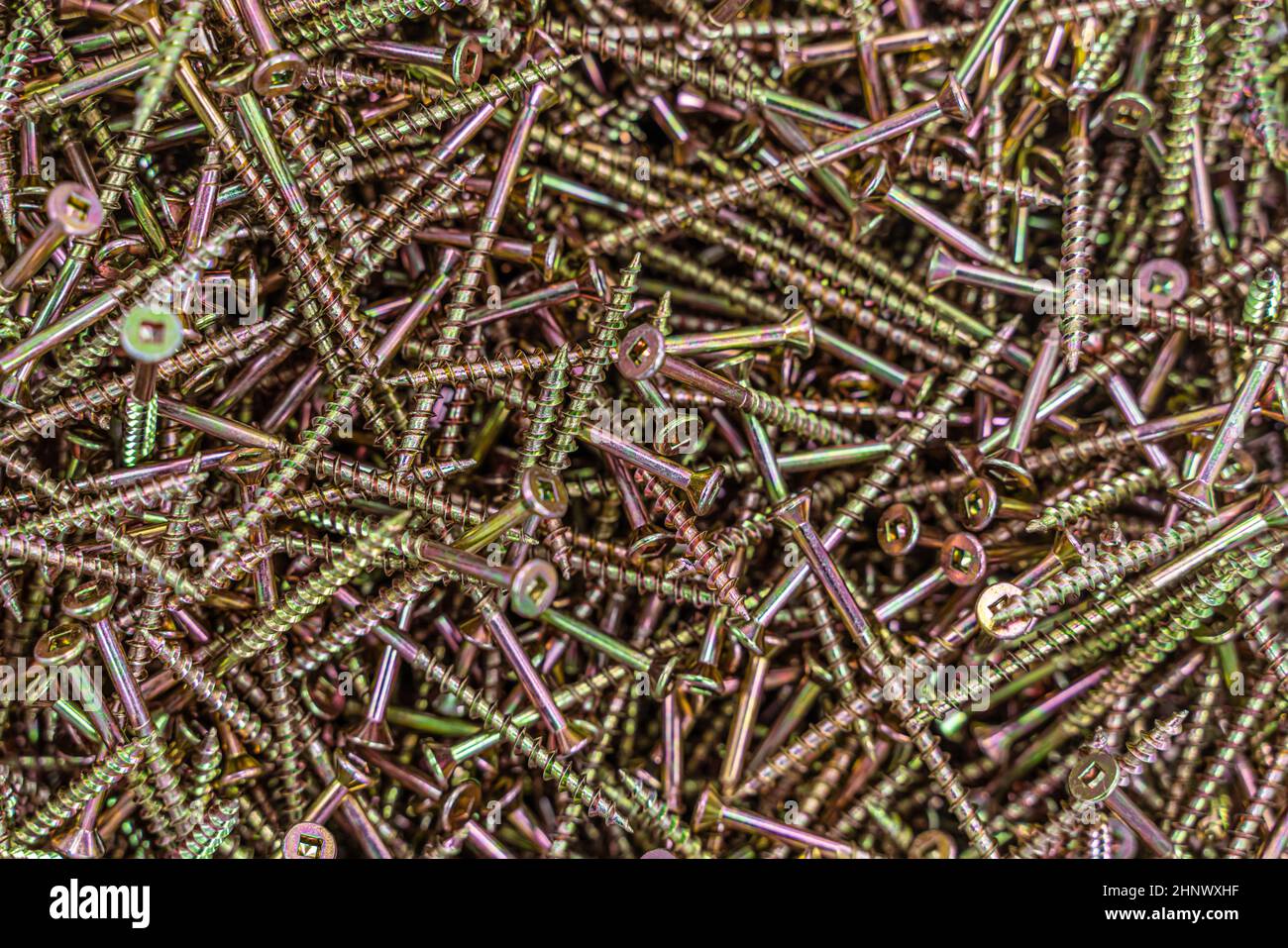 Galvanized deck screws in bucket in a factory workshop Stock Photo - Alamy