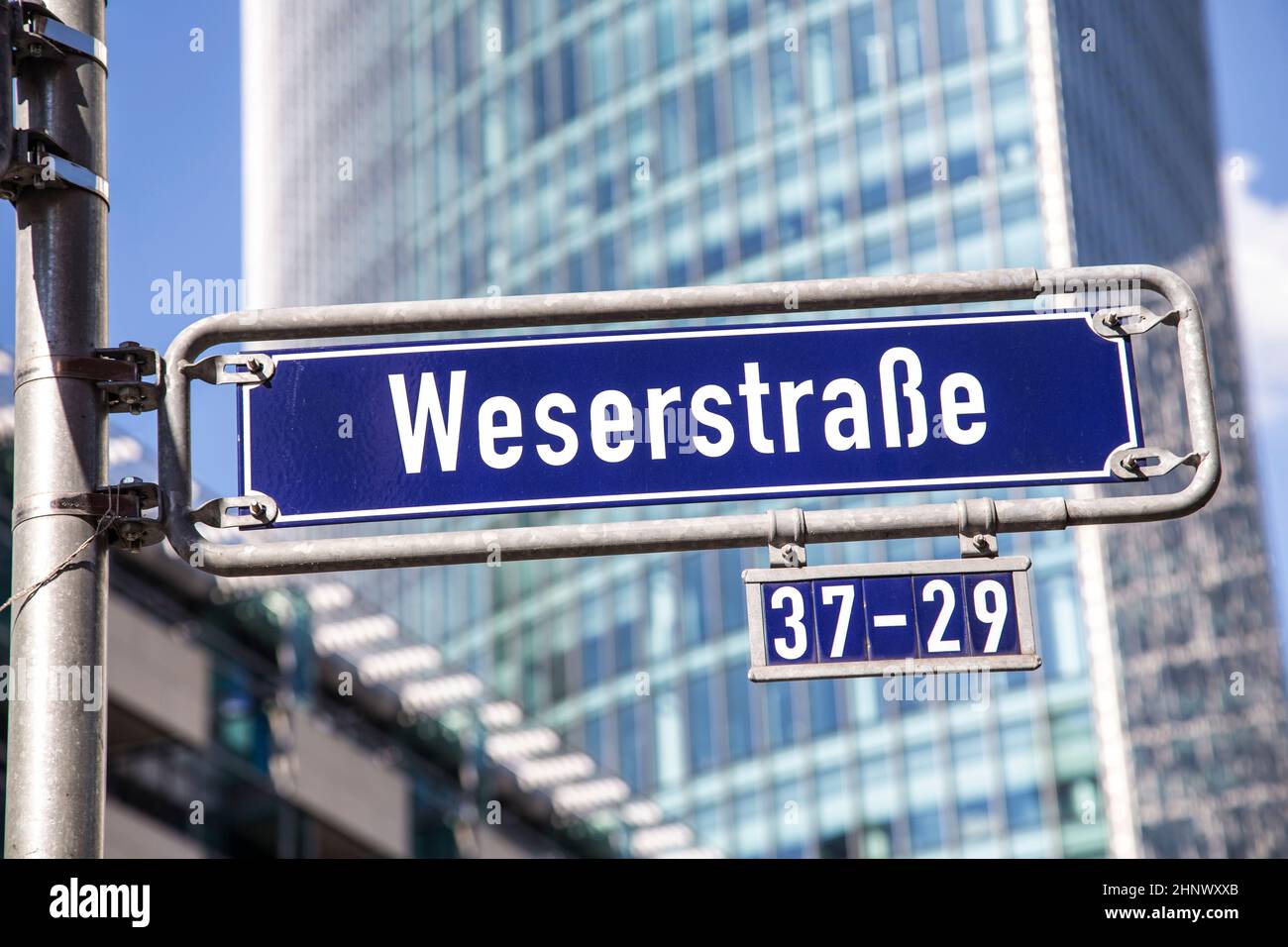 Street name Weserstrasse at the enamel sign on the post Stock Photo - Alamy