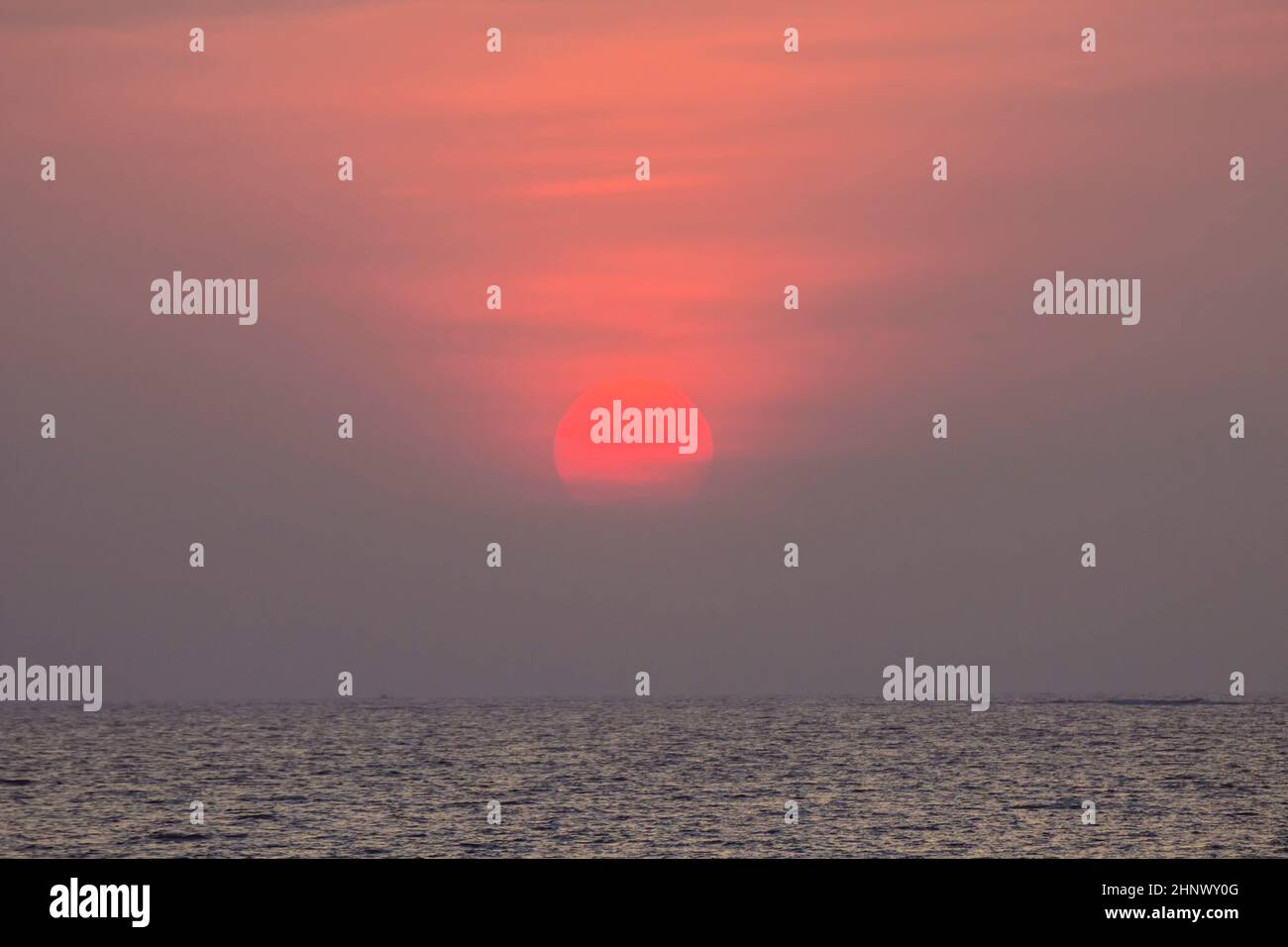spectacular sunset over the ocean at Mumbai, India Stock Photo - Alamy
