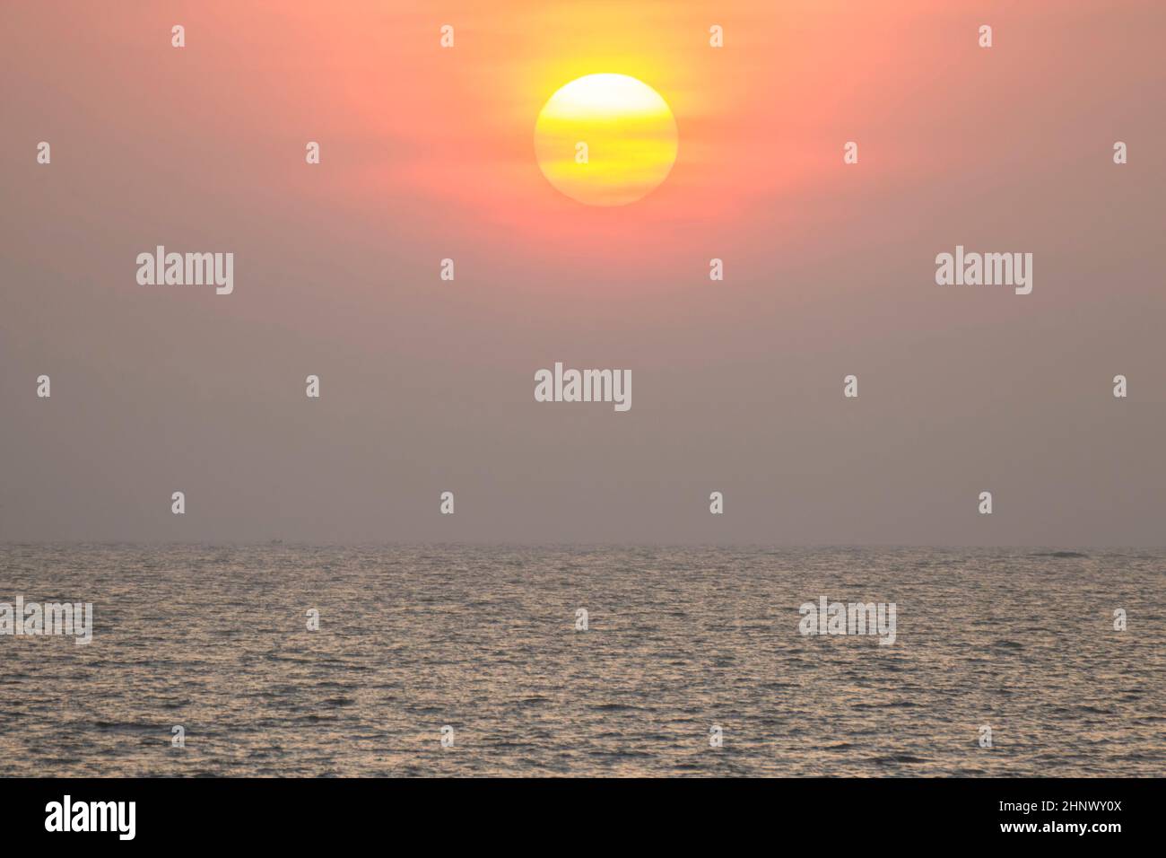 spectacular sunset over the ocean at Mumbai, India Stock Photo - Alamy