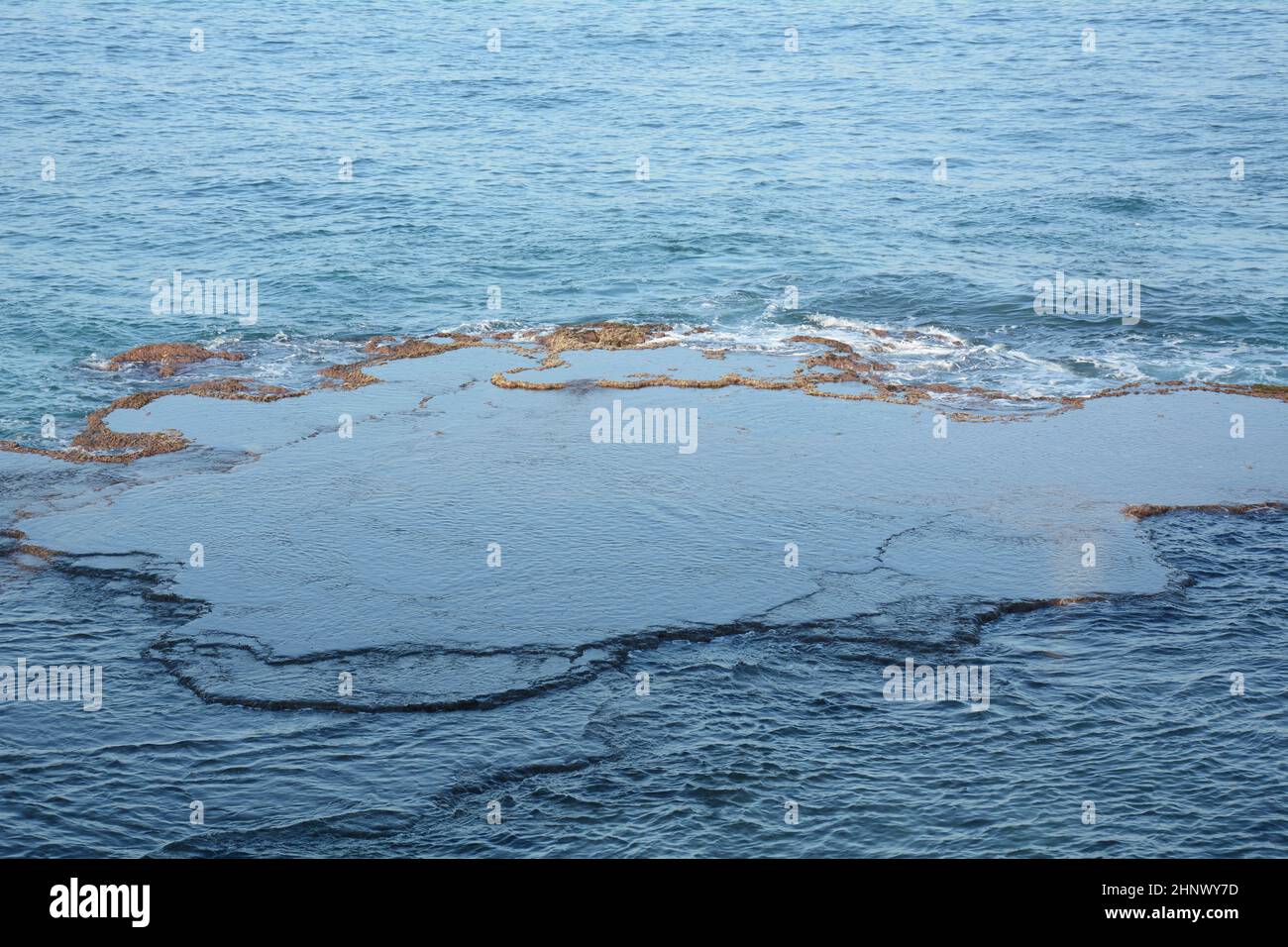 Sea Waves Crashing on the Rocks with White Foam. Swirling frothy foamy ...