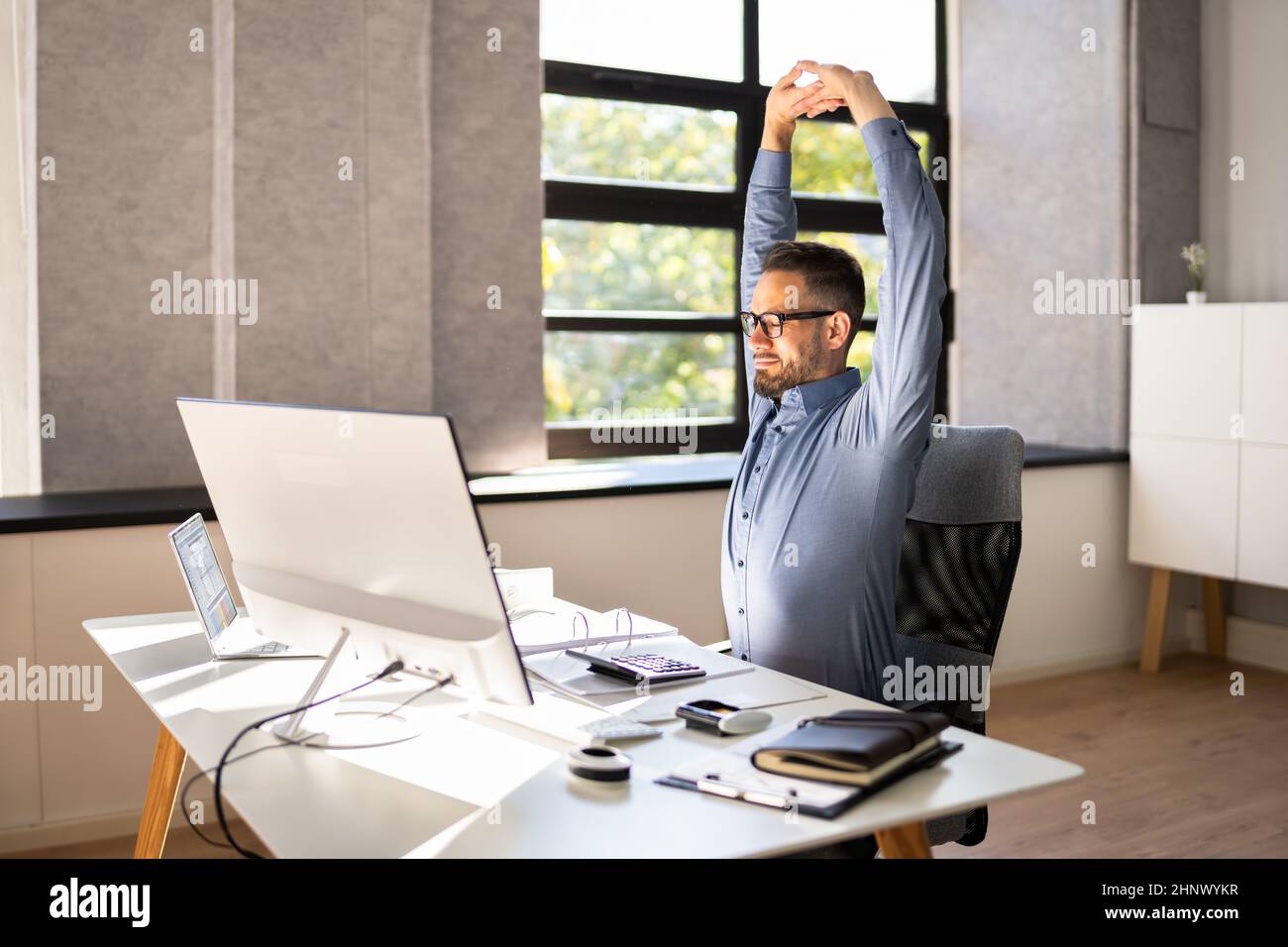 Stretch Exercise Workout At Office Business Desk Stock Photo - Alamy