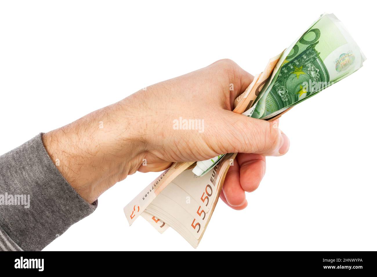 Hand grasps the euro, isolated on white background Stock Photo - Alamy