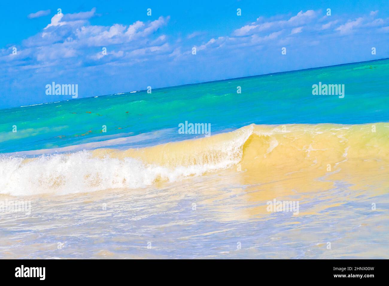 Tropical mexican beach with strong waves and clear turquoise blue water ...