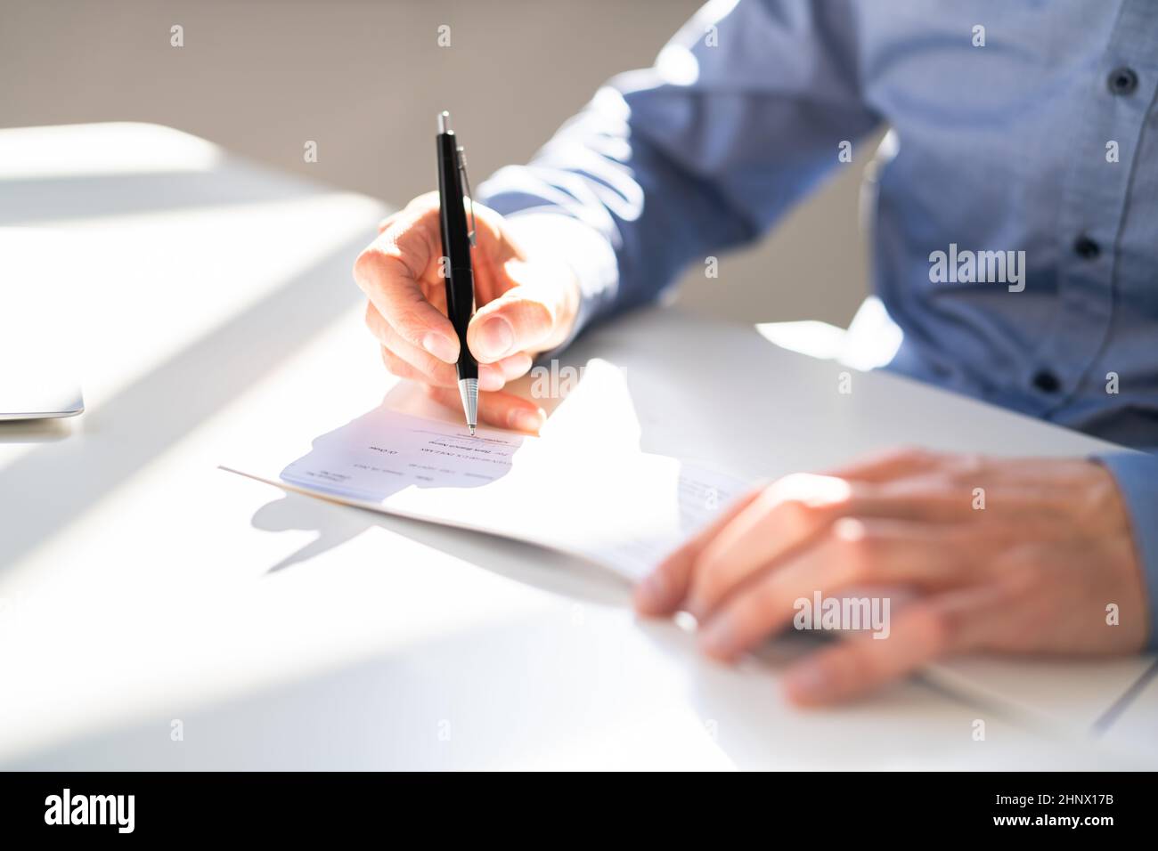 Insurance Paycheck. Payroll Check. Hand Writing Cheque Stock Photo - Alamy