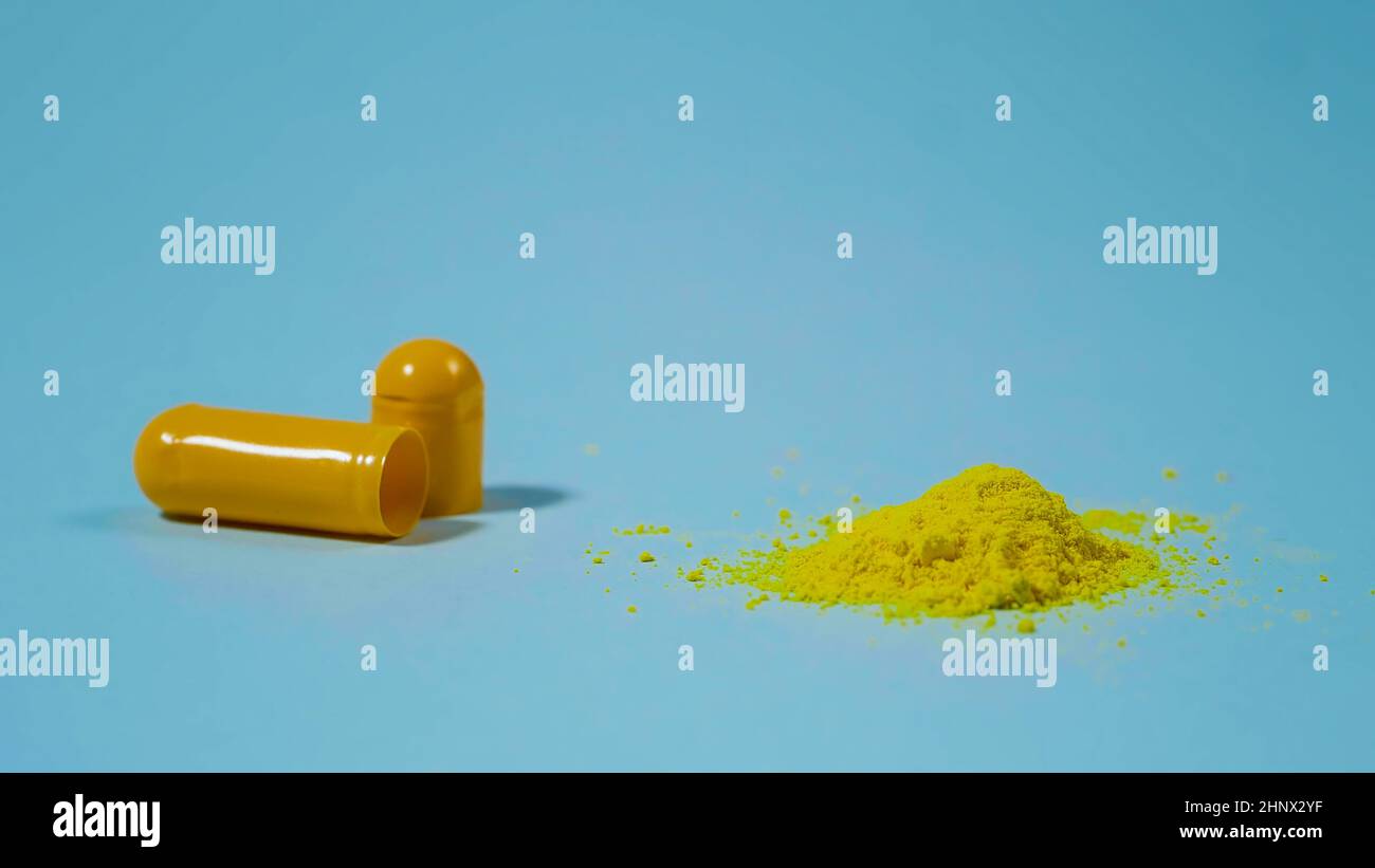 Powder of pills. Yellow medicine from a capsule. Pharmaceutical Concept ...