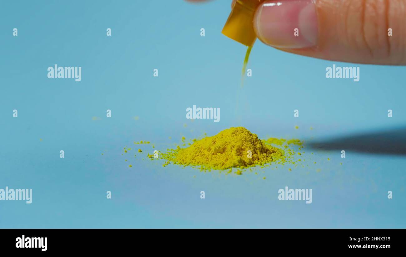 Powder of pills. Yellow medicine from a capsule. Pharmaceutical Concept ...