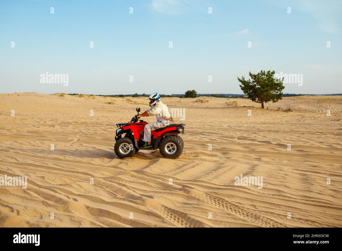 Man rides on atv in desert sands. Male person on quad bike, sandy race ...