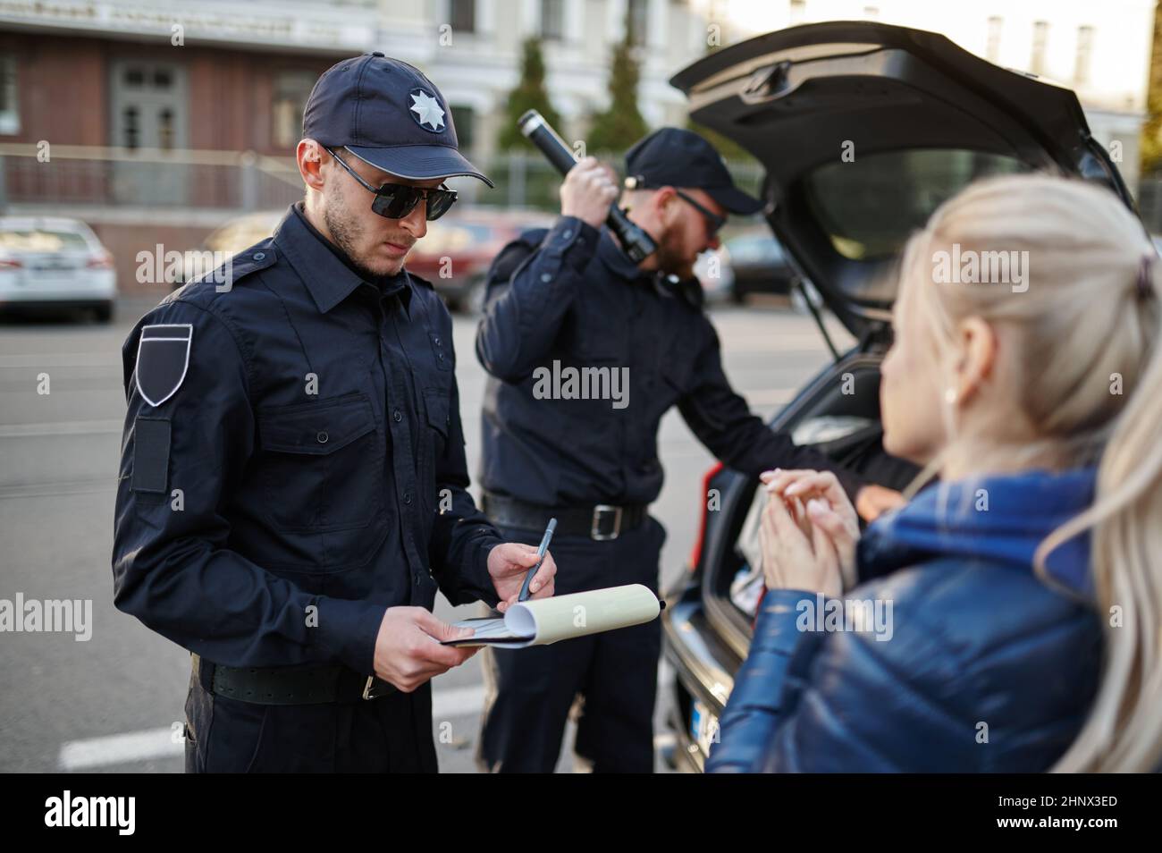 Police checking car trunk hi-res stock photography and images - Alamy