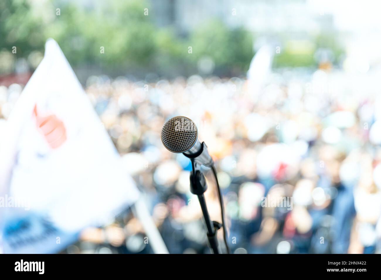 Public demonstration or political protest. Microphone in focus against ...