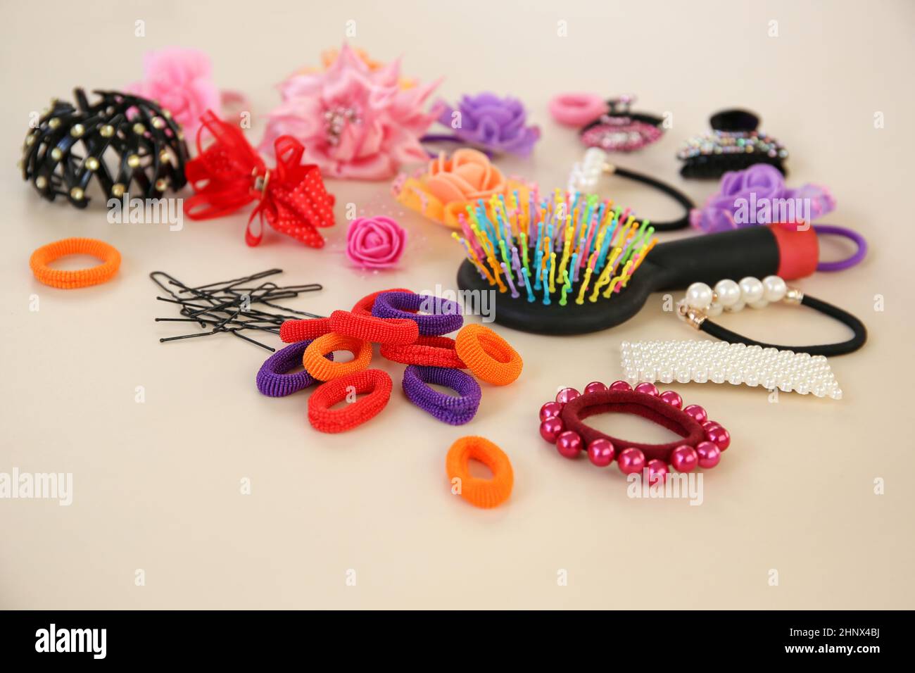 Different hair clips on beige background Stock Photo - Alamy