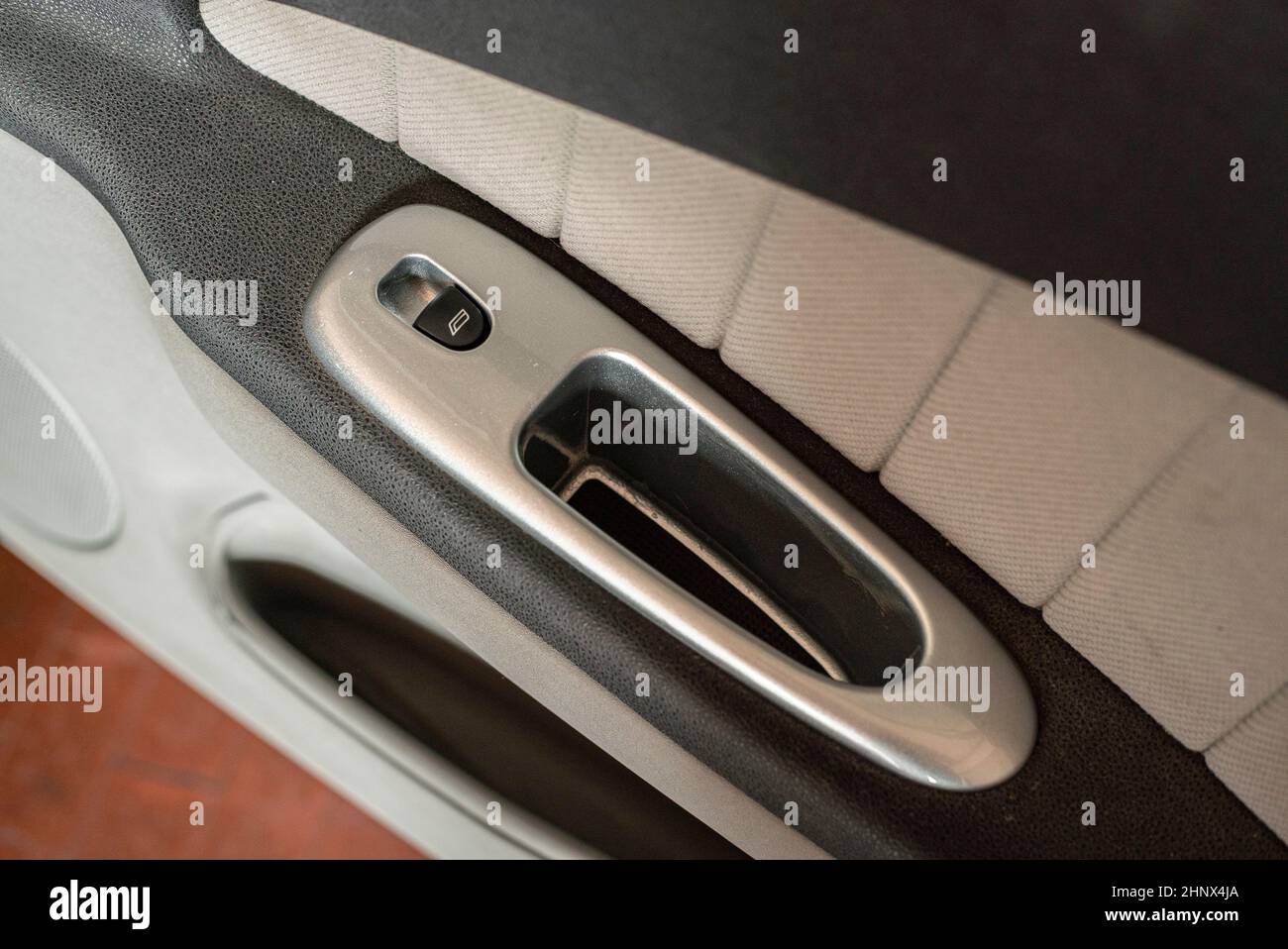 Car window button detail in the car door Stock Photo - Alamy