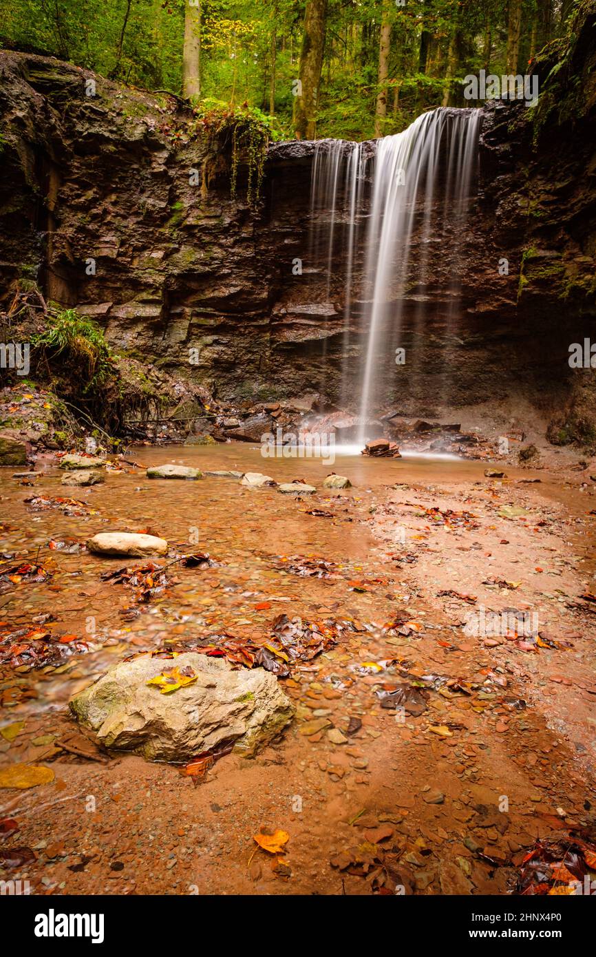 Waterfall cascade of german stream iandscape in vertical format Stock ...