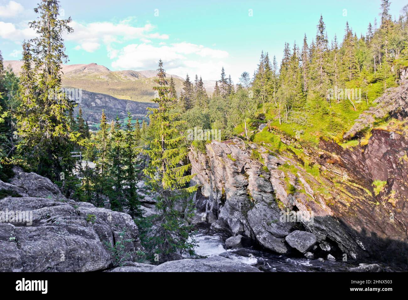 River of the beautiful waterfall Rjukandefossen with mountain and ...