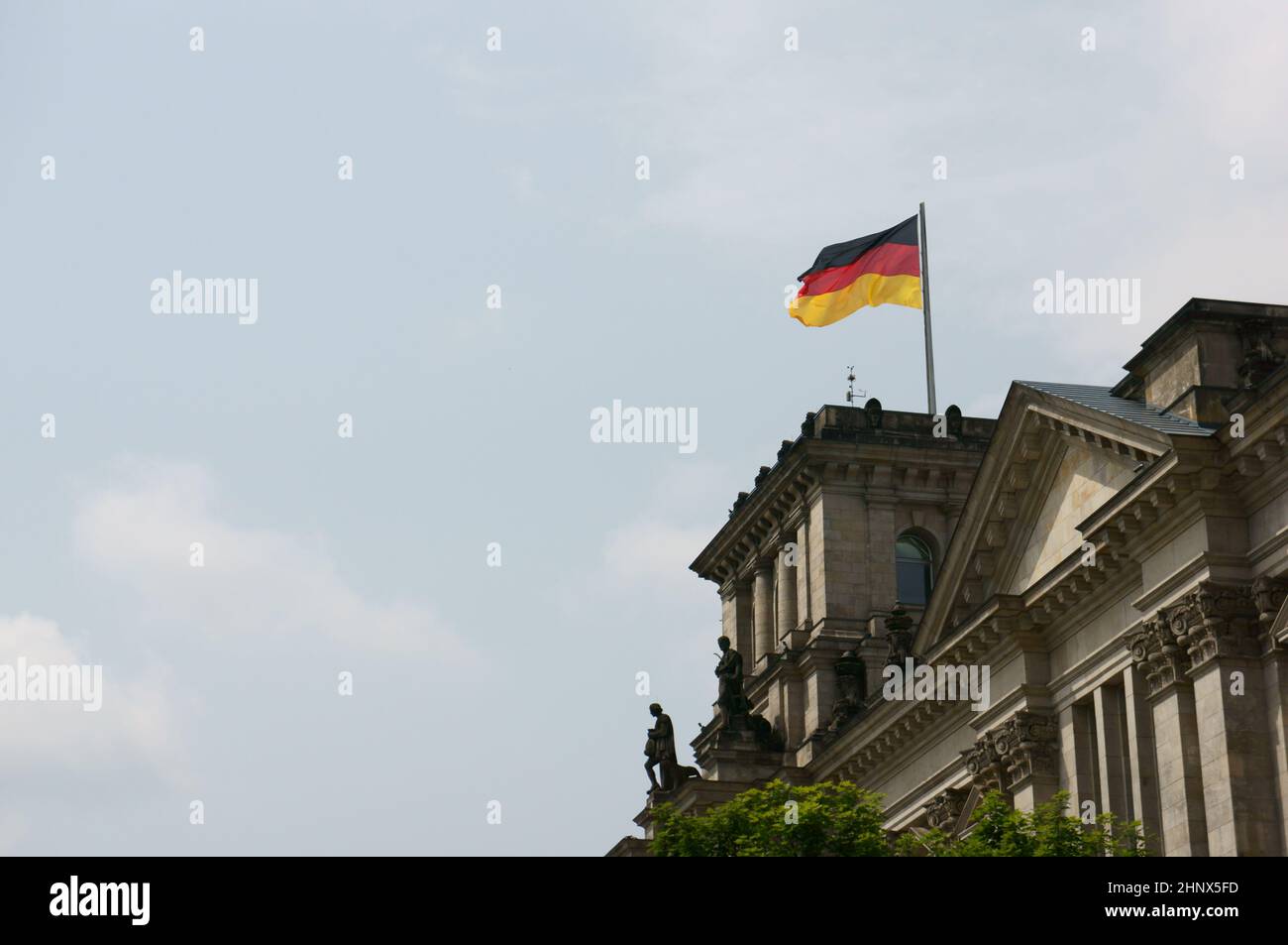 The German flag of the Reichstag building in the city center Stock ...