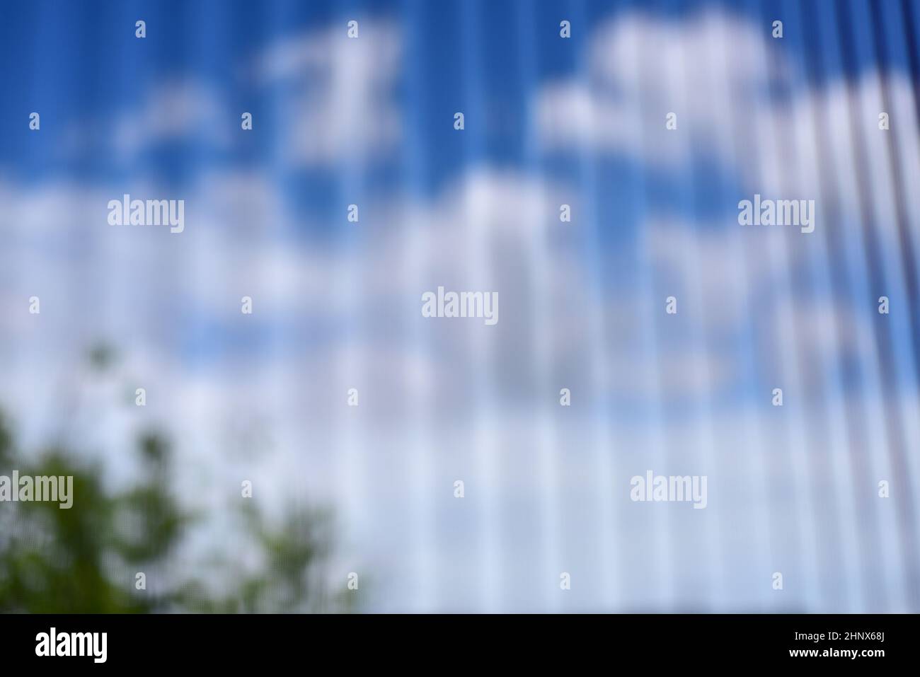 blurry view blue sky with cloud through soft white curtain from bedroom ...