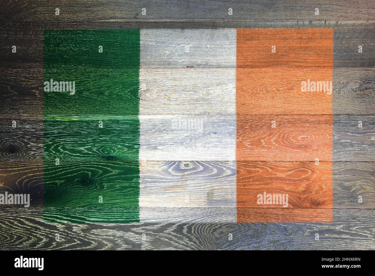 An Ireland flag on rustic old wood surface background Stock Photo - Alamy