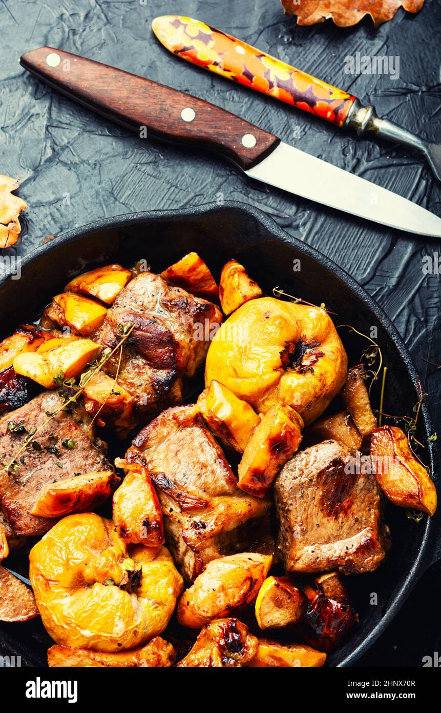 Delicious stewed meat with aromatic autumn quince Stock Photo - Alamy