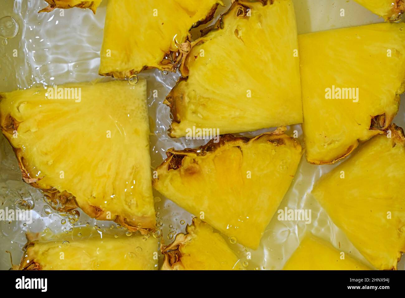 Close-up fresh slices of yellow pineapple on white background. Slices ...