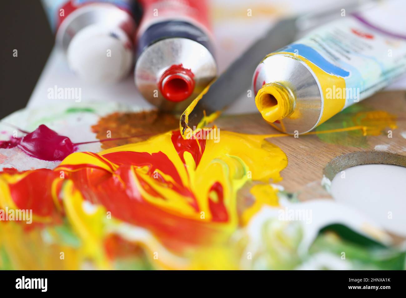 On wooden palette a mixture of paints for painting Stock Photo - Alamy