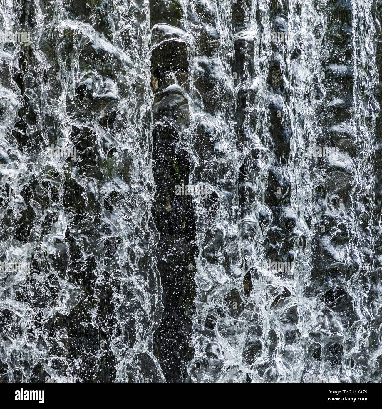 pattern of flowing water at a waterfall gives a harmonic background ...