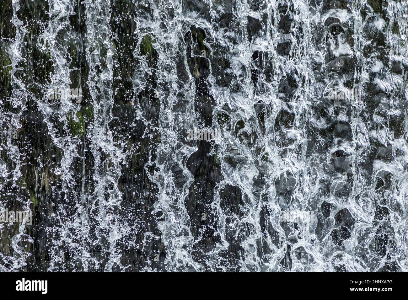 pattern of flowing water at a waterfall gives a harmonic background ...