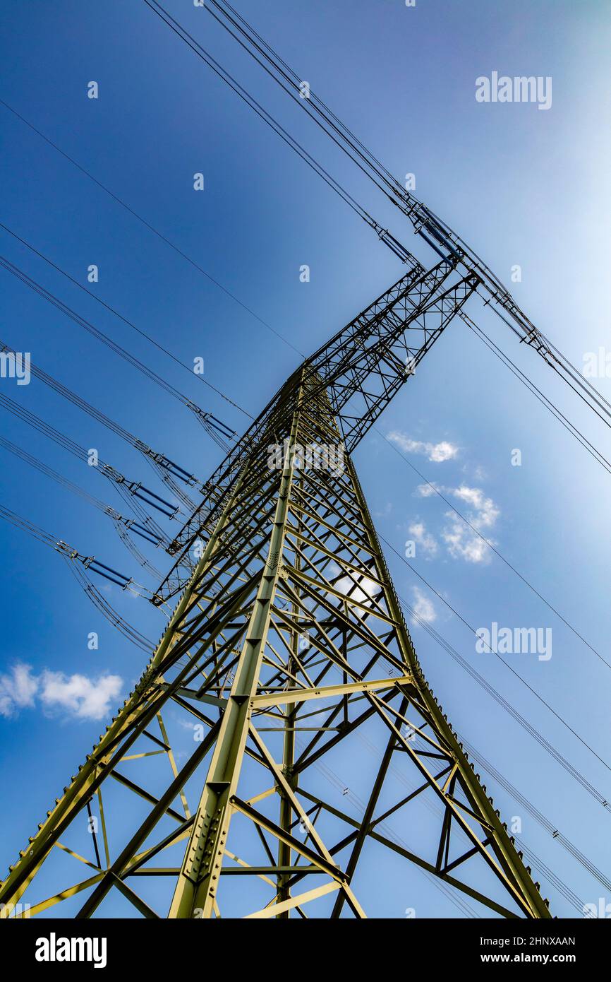 electric pylon under blue sky as industry background Stock Photo - Alamy