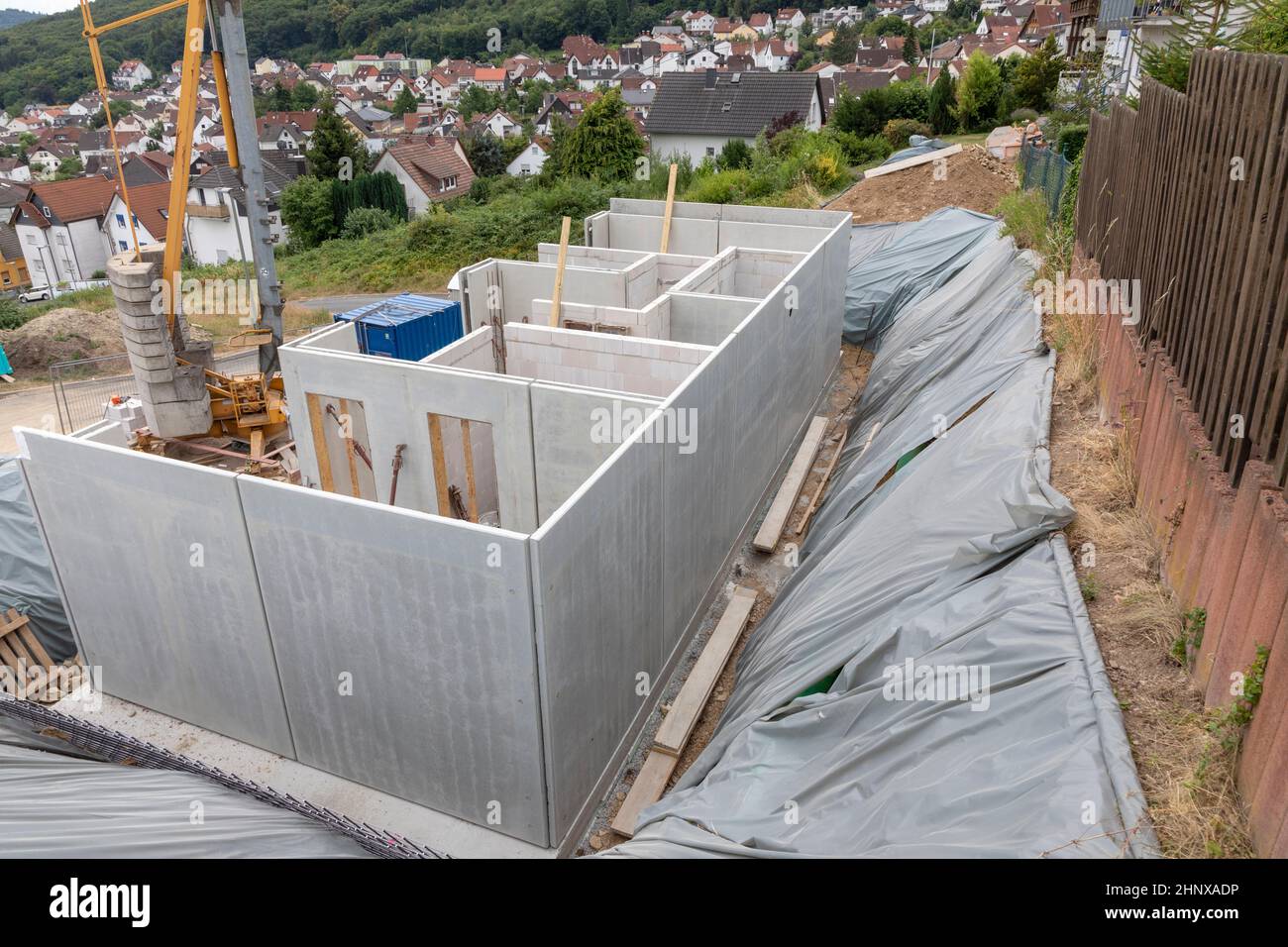 unfinished construction site of a family house with ready to use walls ...