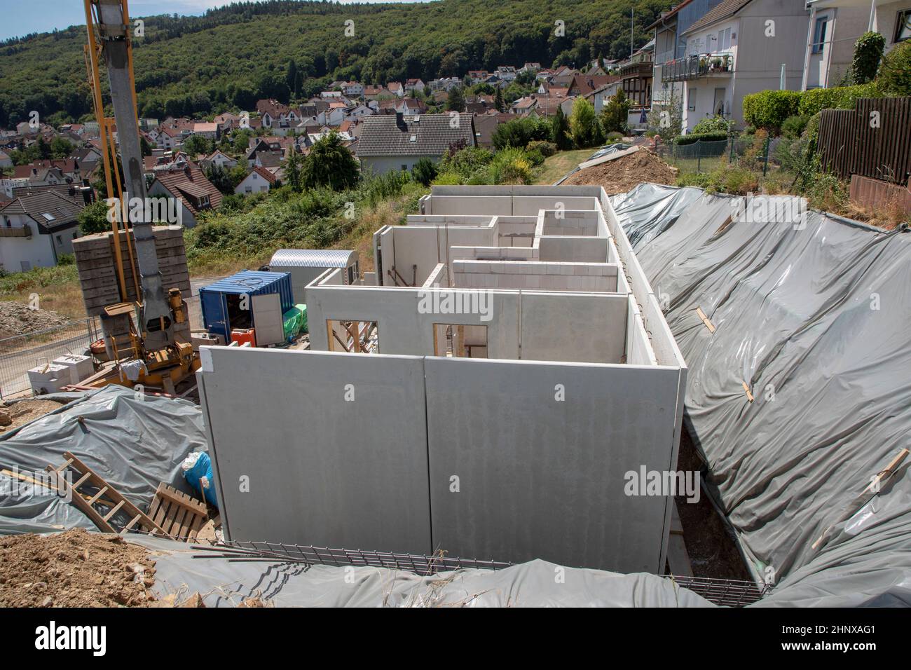 unfinished construction site of a family house with ready to use walls ...