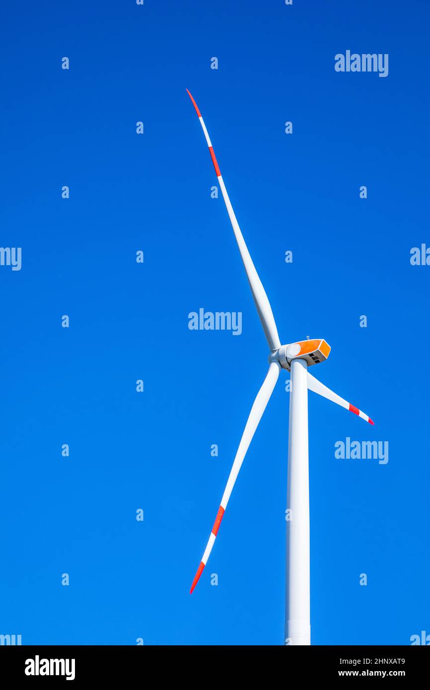 wind turbine under clear blue sky Stock Photo - Alamy