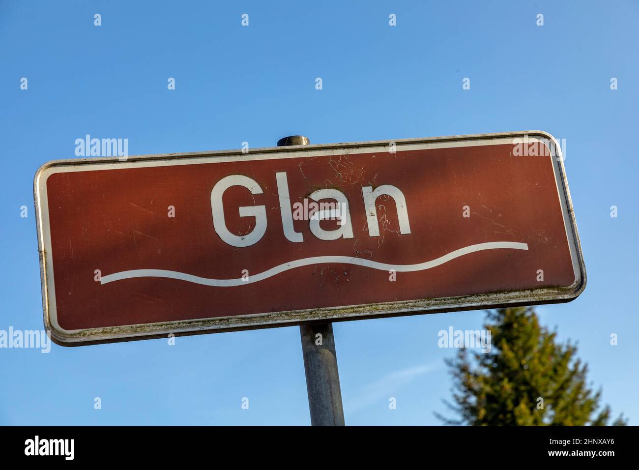 sign river Glan under blue sky with wave symbol and brown color as ...