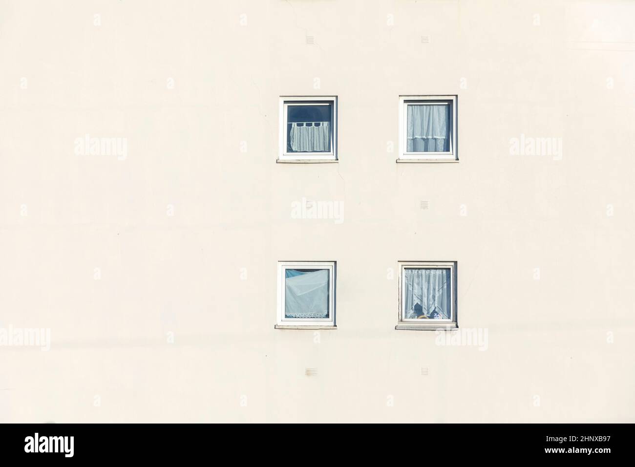 typical windows with curtains of an apartment house in Germany as ...