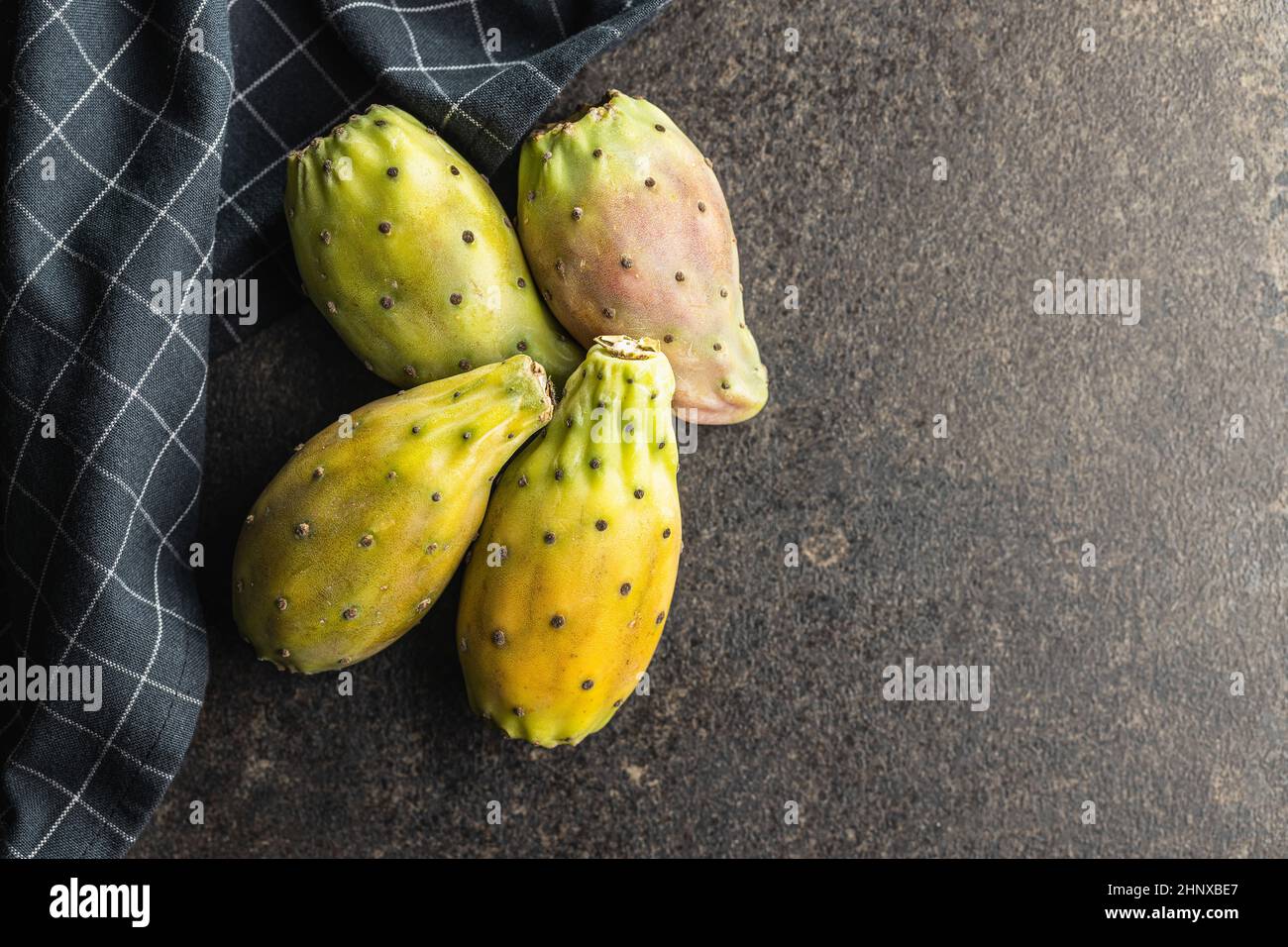 Raw prickly pears. Opuntia or indian fig cactus on kitchen table. Top ...