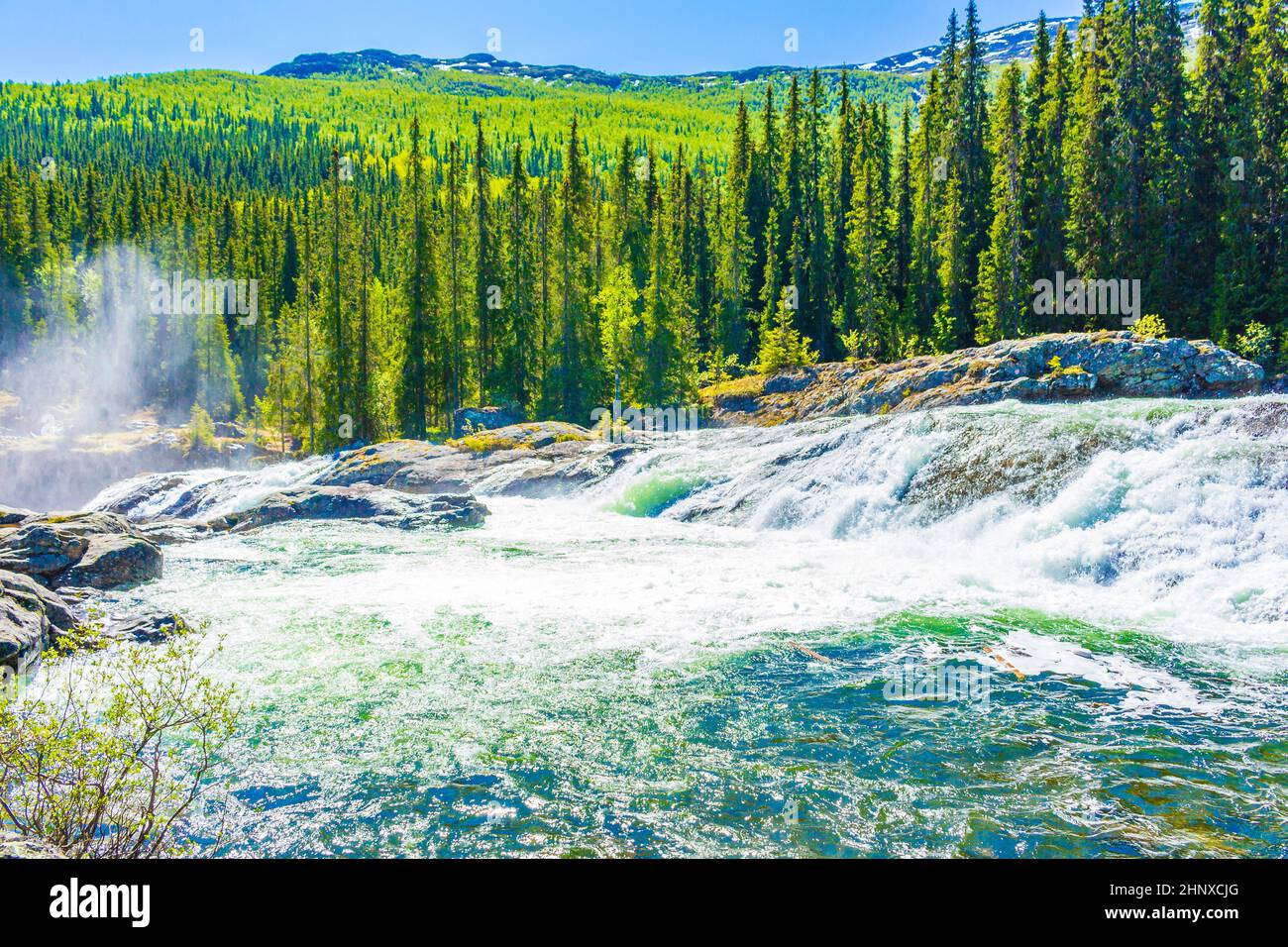 Fast flowing river water of the waterfall Rjukandefossen in Hemsedal ...