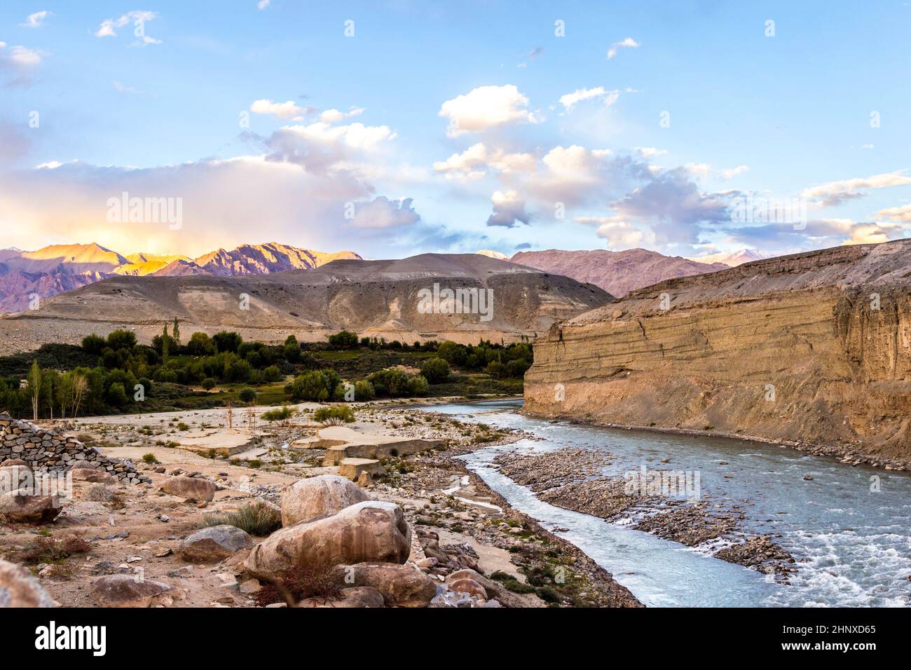 river in Ladakh with view to the mounainrange of the himalaya under ...