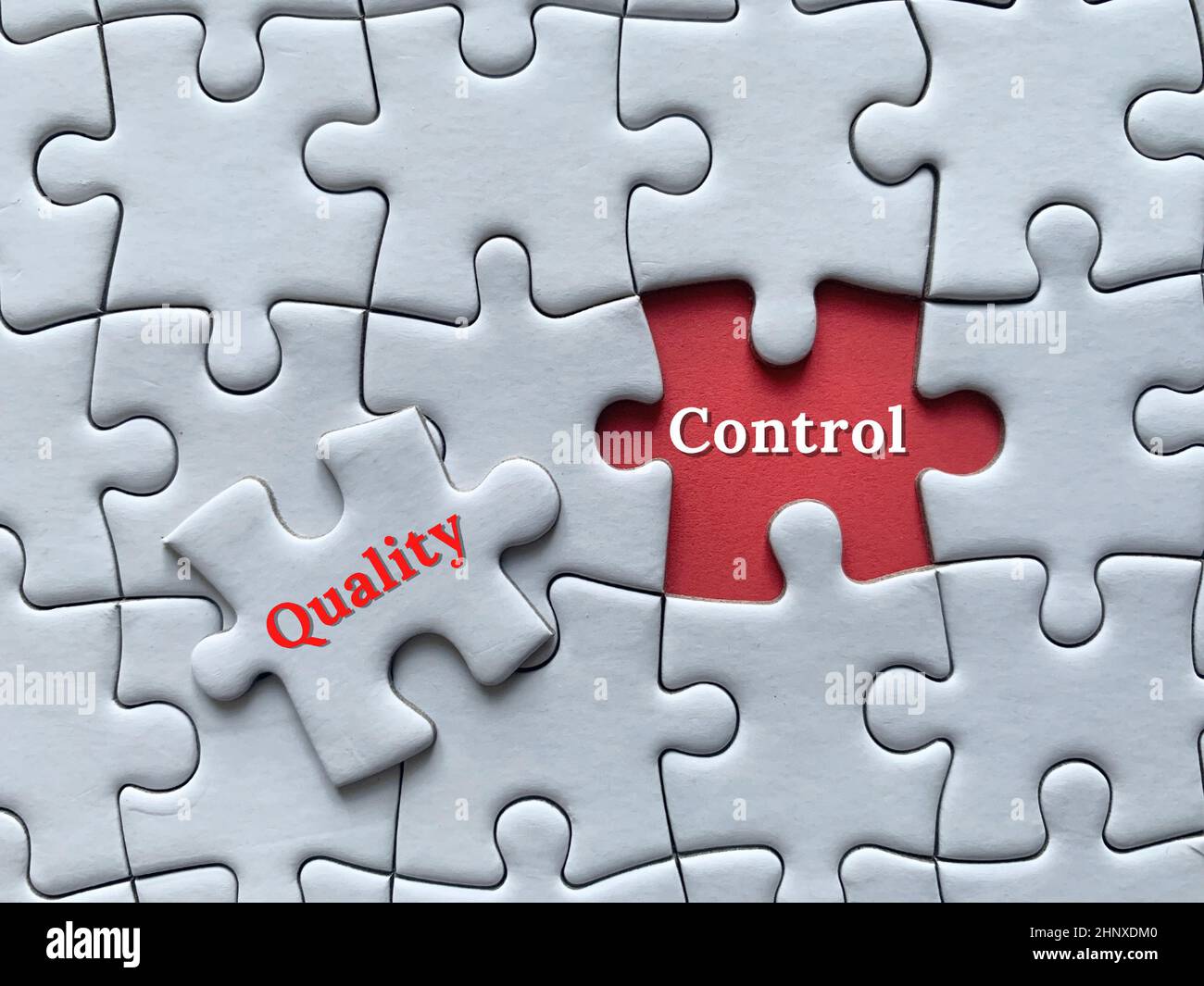 Top view of words with jigsaw puzzle background - Quality control ...