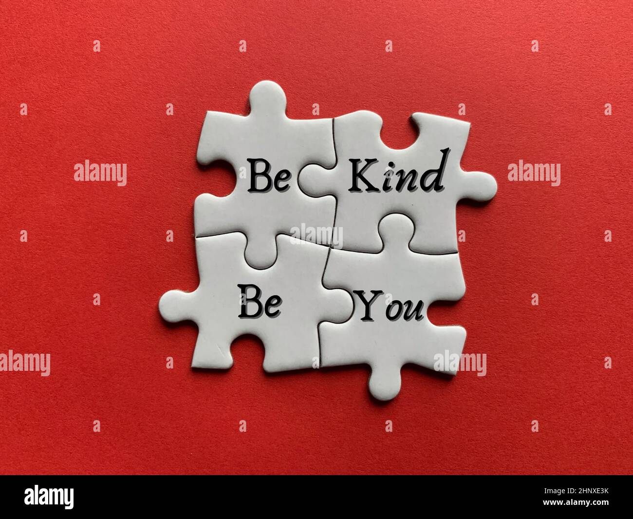 Top view of words on jigsaw puzzle - Be kind, be you. Motivational ...