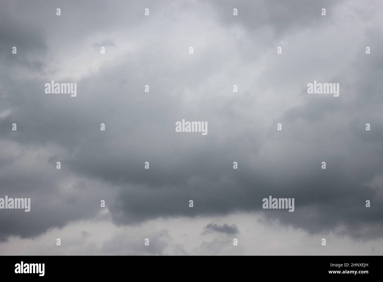 Cloudy sky background with grey clouds. Grey fluffy clouds on blue sky ...