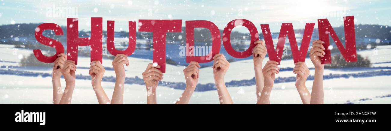 People Hands Holding Colorful English Word Shutdown. Snowy Winter Background With Snowflakes ...
