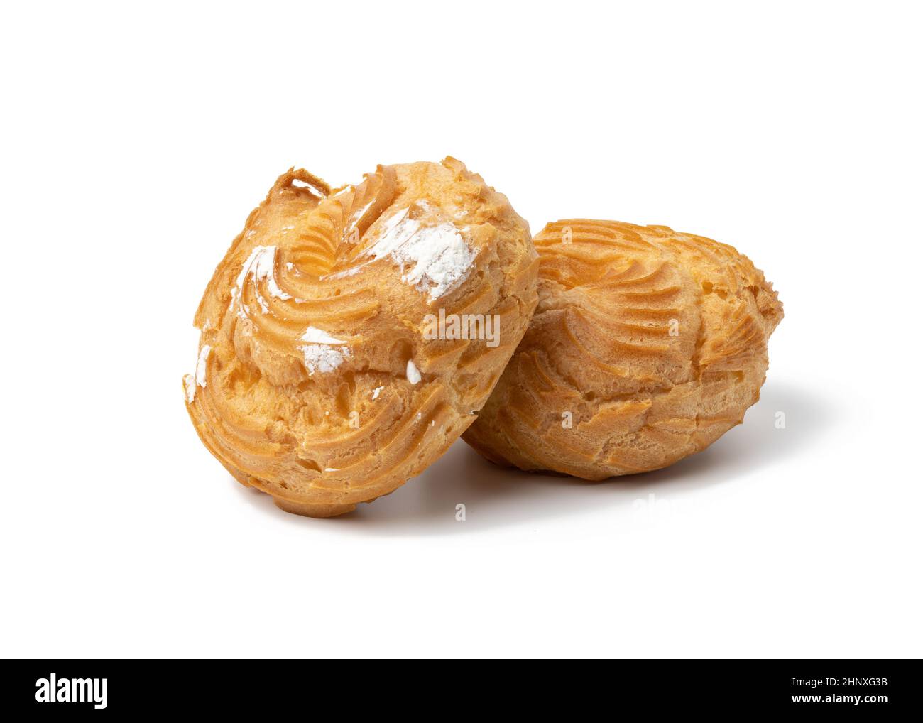 two baked round eclairs on a white background Stock Photo - Alamy