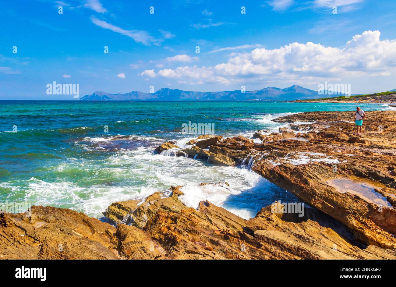 Male traveler and tourist is watching the rough natural coastal and ...