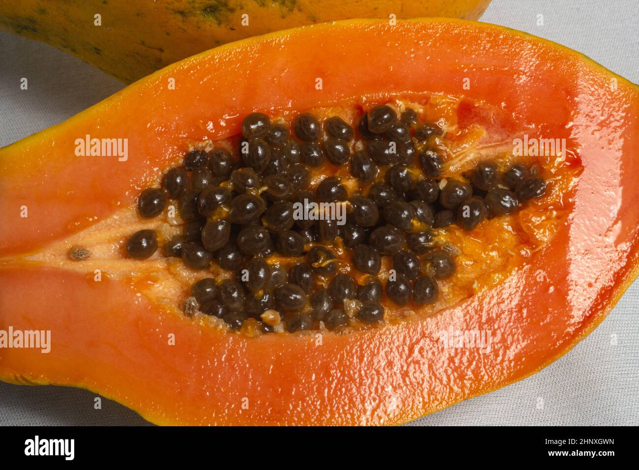 Half Cut of Fresh Ripe Papaya with seeds isolated on white background ...