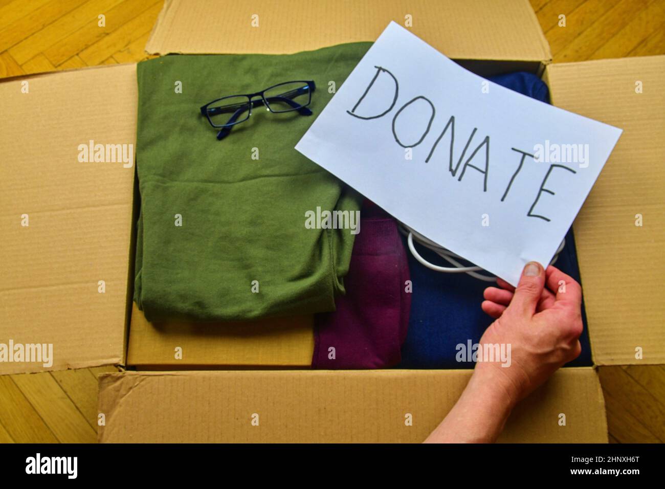 Donation concepts with hands of man holding text DONATE . Giving and ...