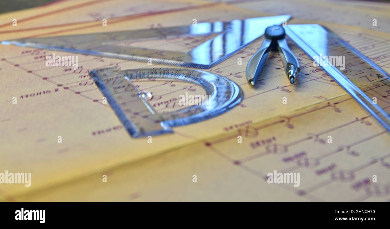 Electrical engineer workplace - electrotechnical project, rulers, and ...