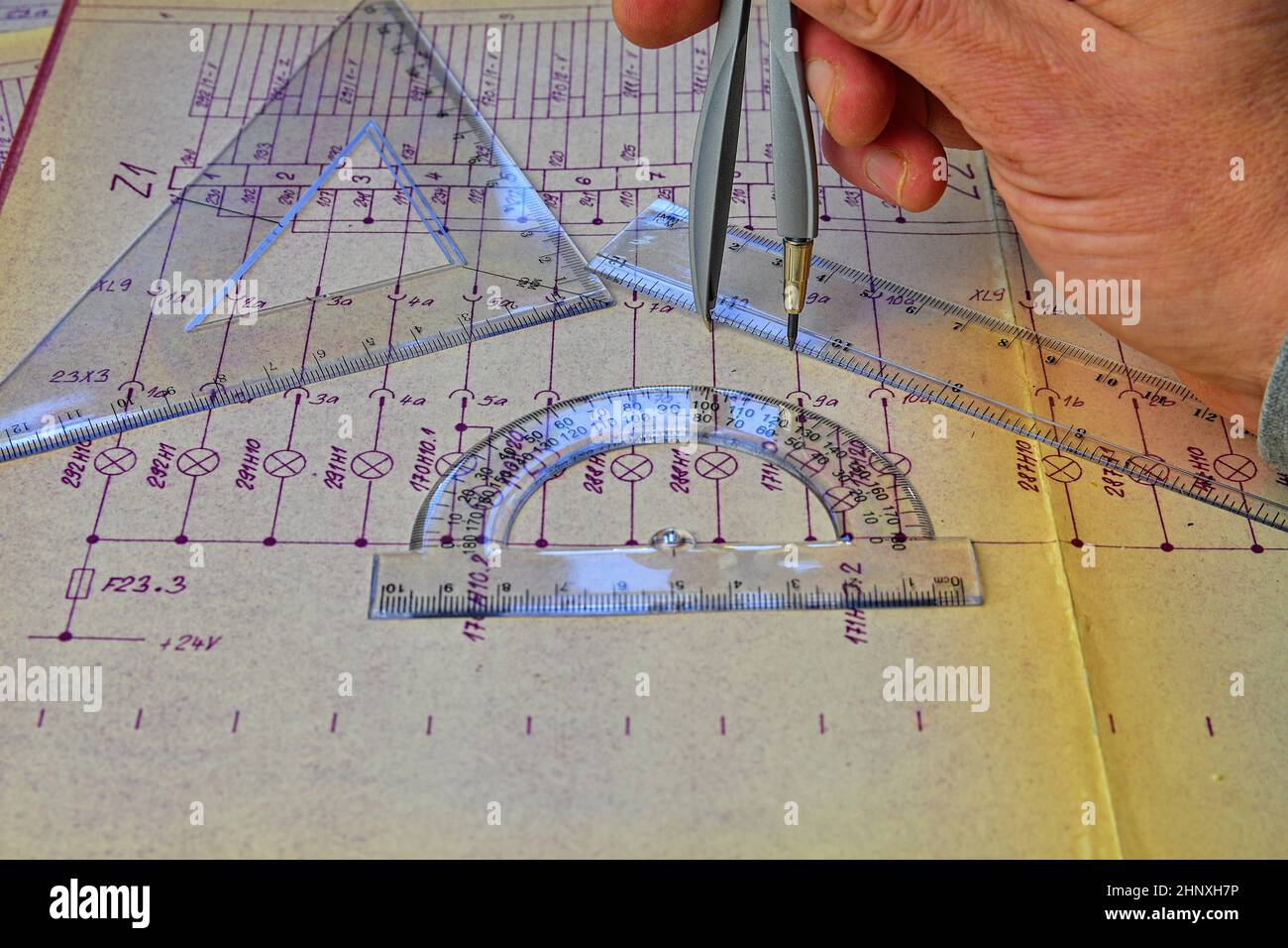 Electrical engineer workplace - electrotechnical project, rulers, and ...