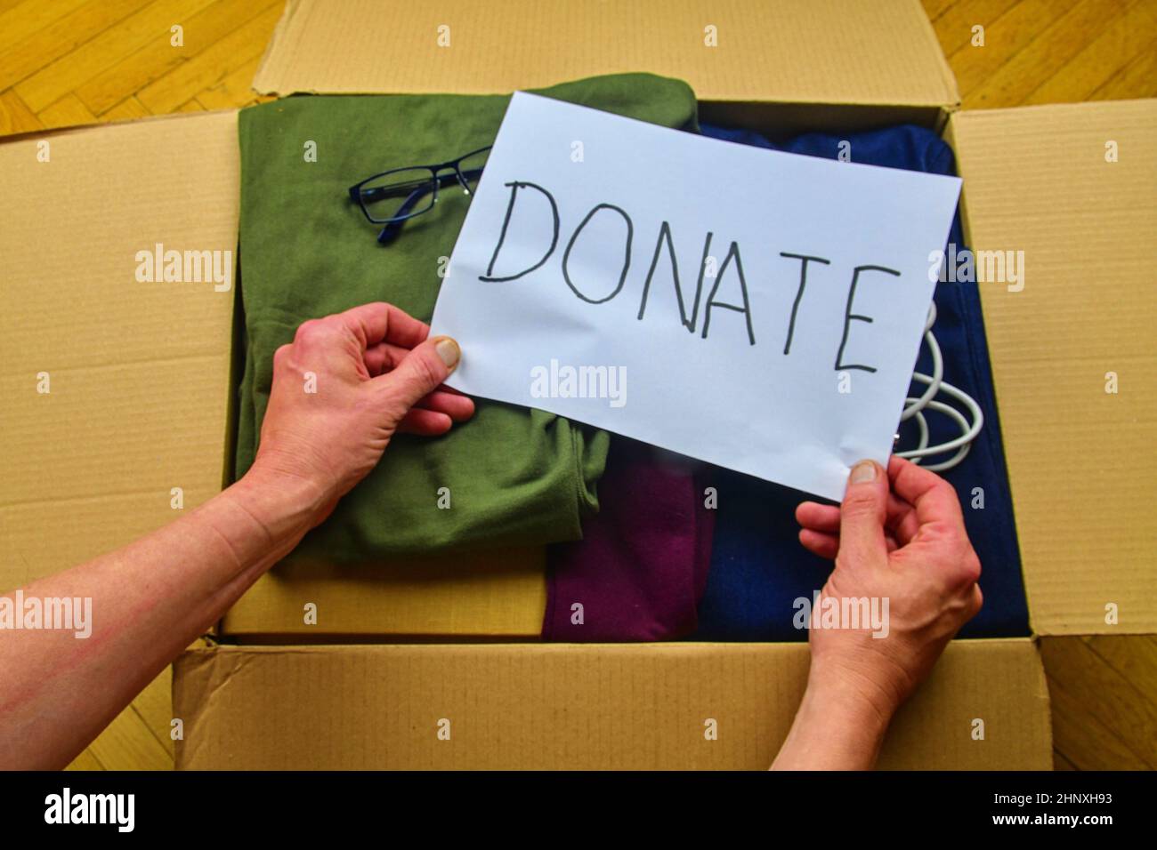 Donation concepts with hands of man holding text DONATE . Giving and ...