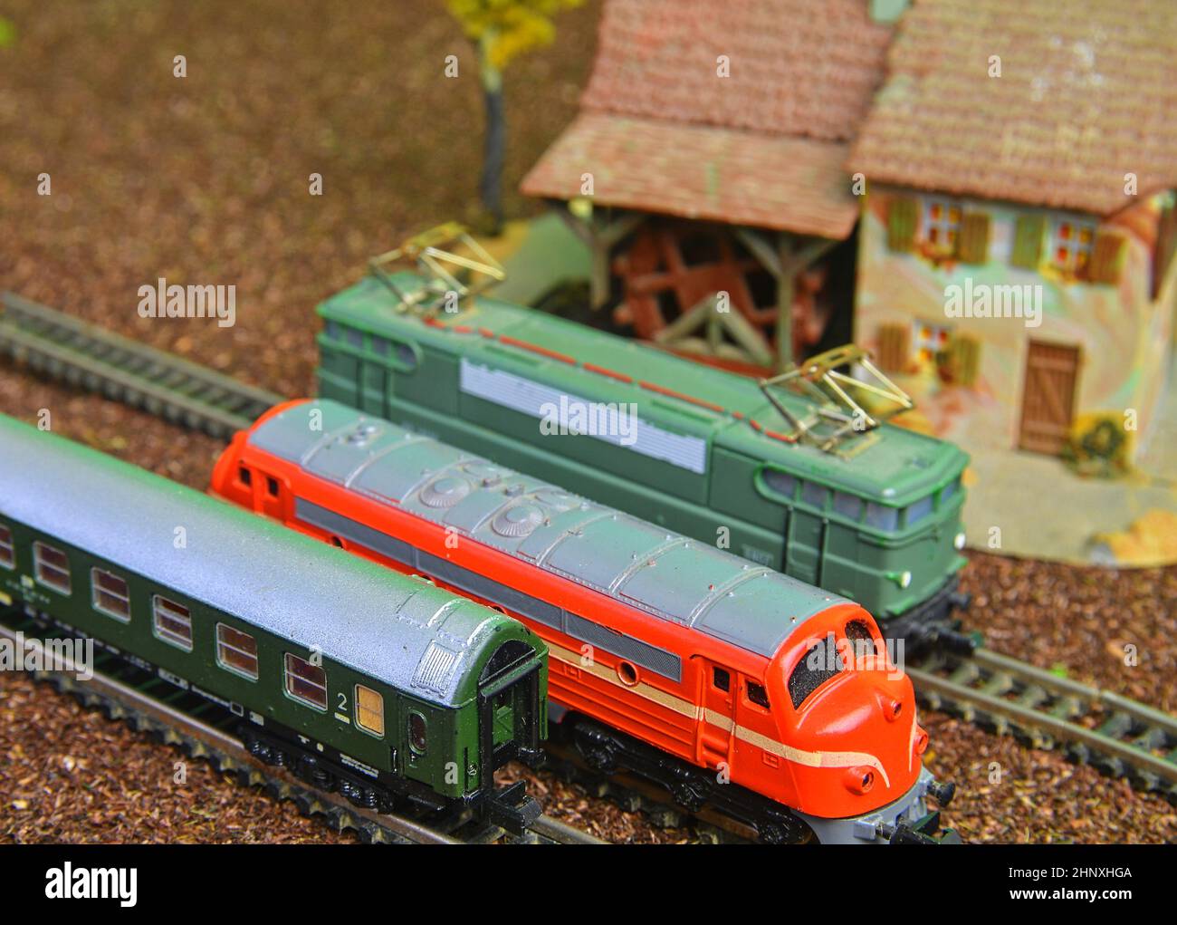 Close-up of model railway carriage on the rail tracks. Perfect model of ...
