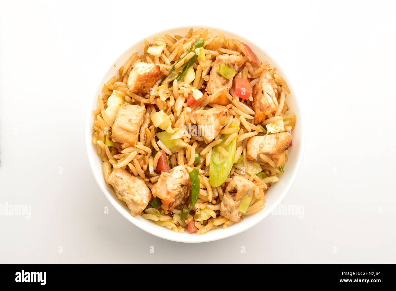top view of chicken fried rice in bowl isolated on white background ...